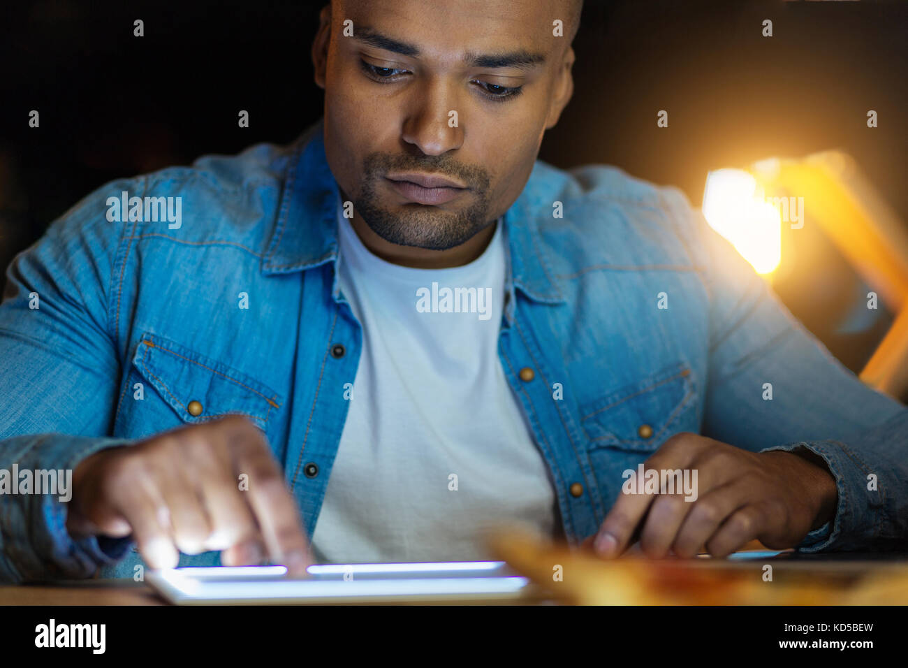 Concentrated male person being at work Stock Photo - Alamy