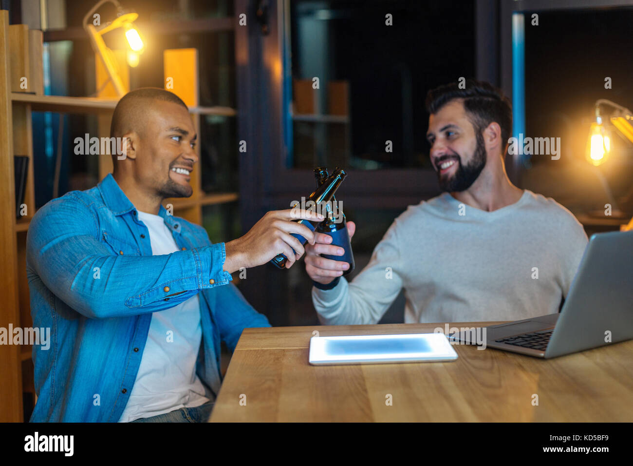 Relaxed colleagues having party after work Stock Photo - Alamy
