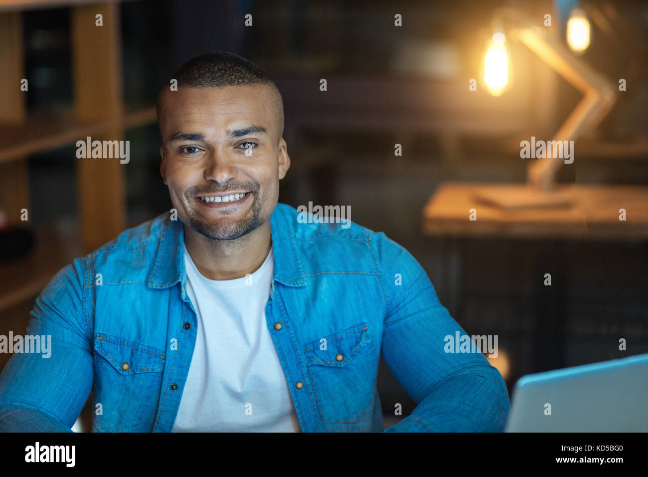 Portrait of delighted man that siting in his office Stock Photo - Alamy