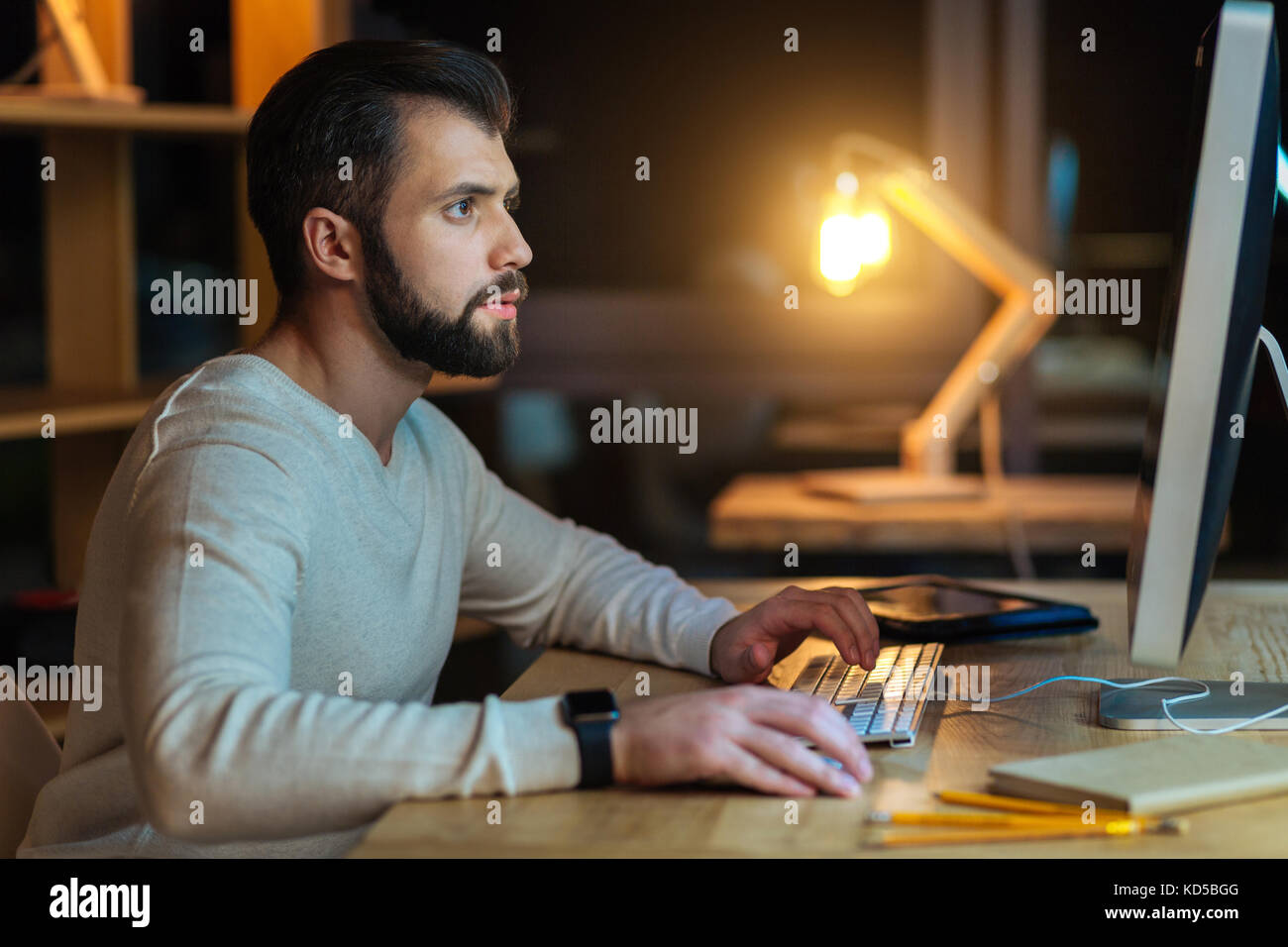 Attractive professional worker doing his job Stock Photo - Alamy