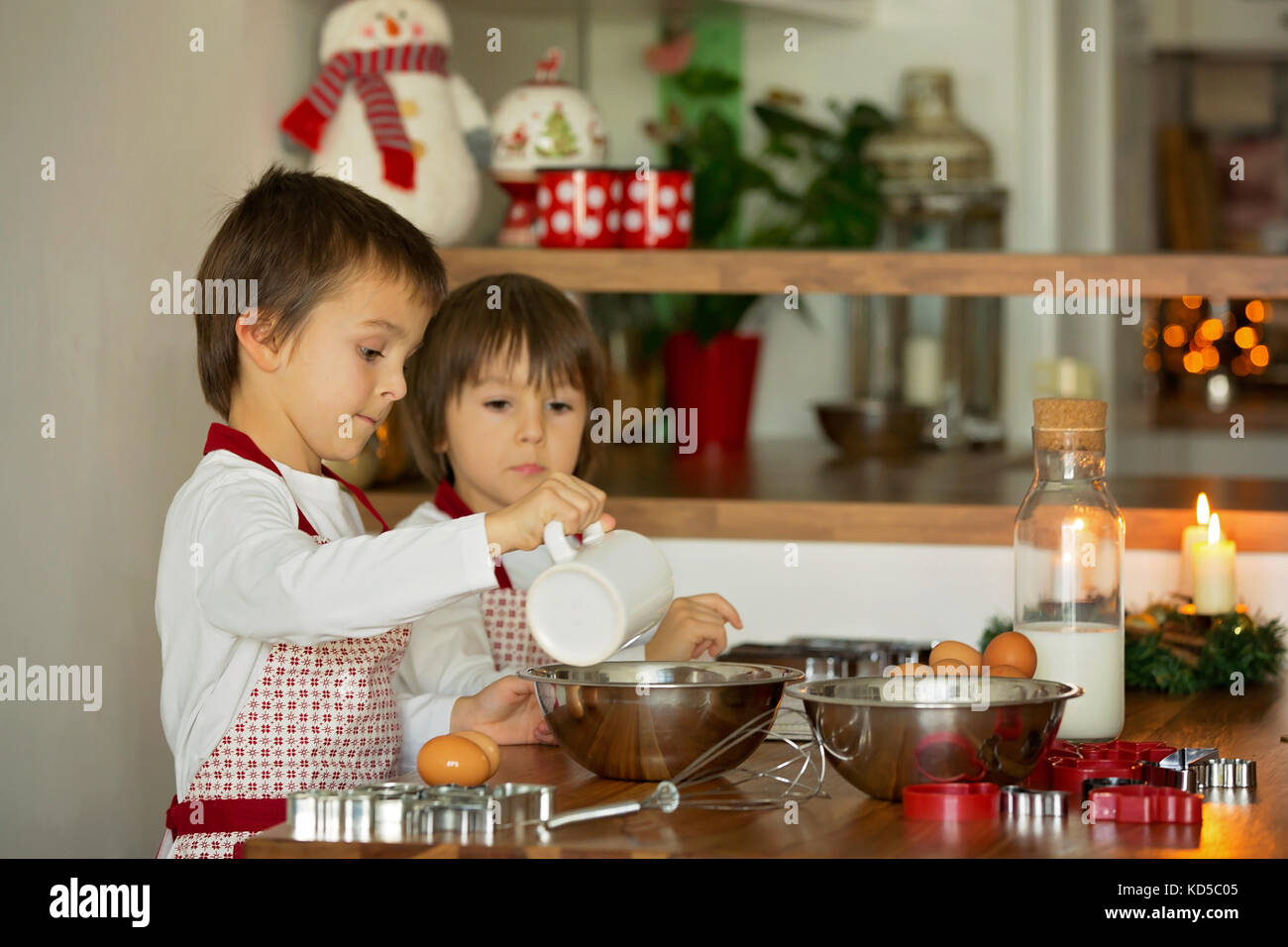 Two sweet children, boy brothers, preparing gingerbread cookies for ...