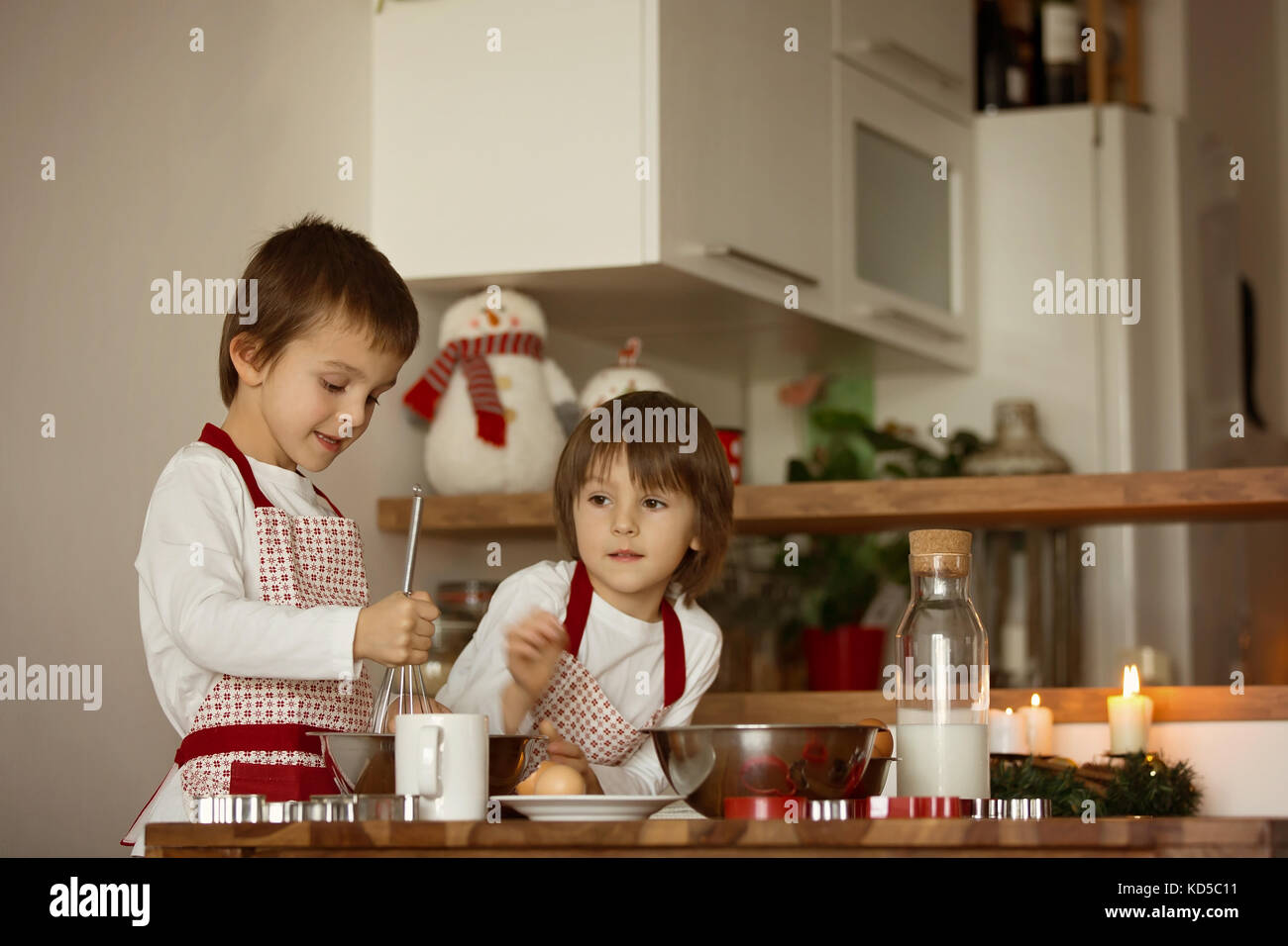 Two sweet children, boy brothers, preparing gingerbread cookies for ...