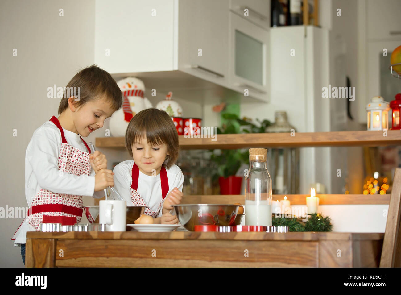 Two sweet children, boy brothers, preparing gingerbread cookies for ...