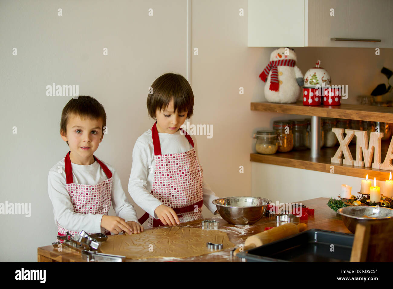 Two sweet children, boy brothers, preparing gingerbread cookies for ...