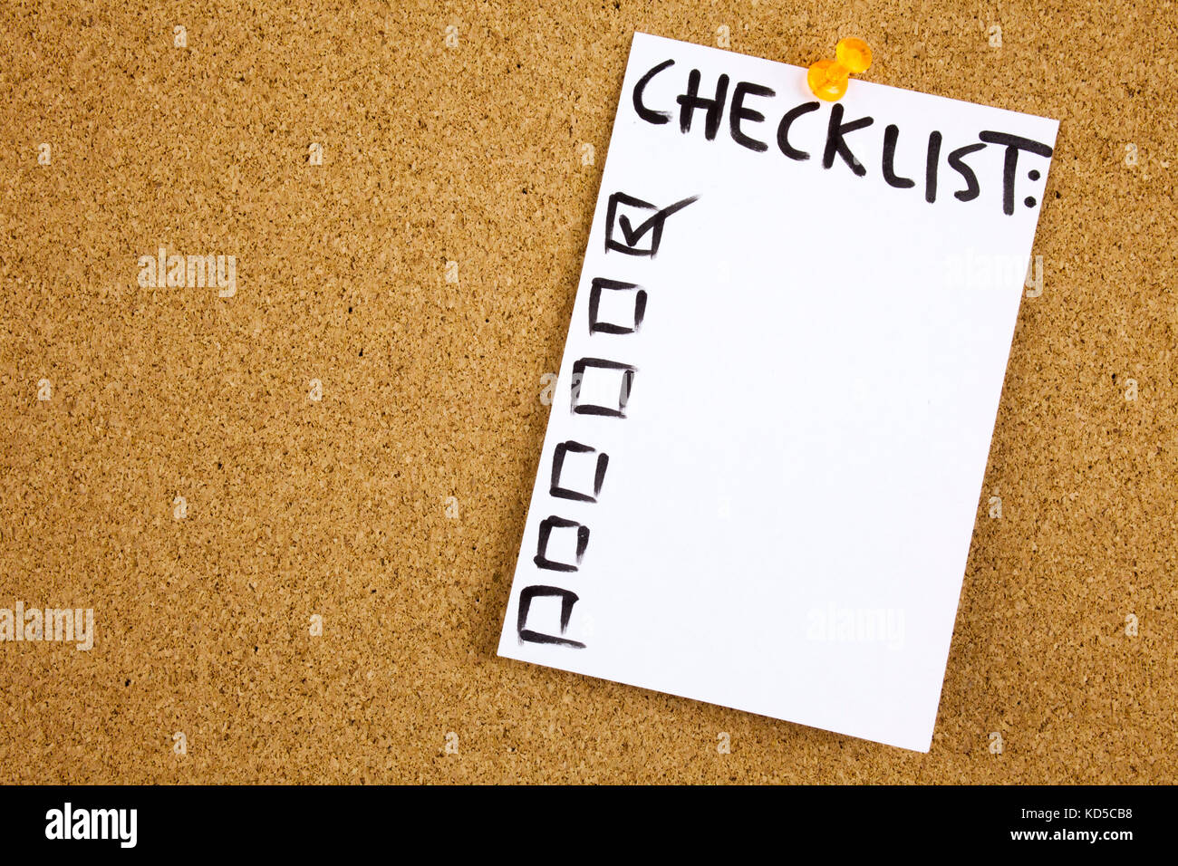 A yellow sticky note writing, caption, inscription Checklist on ...