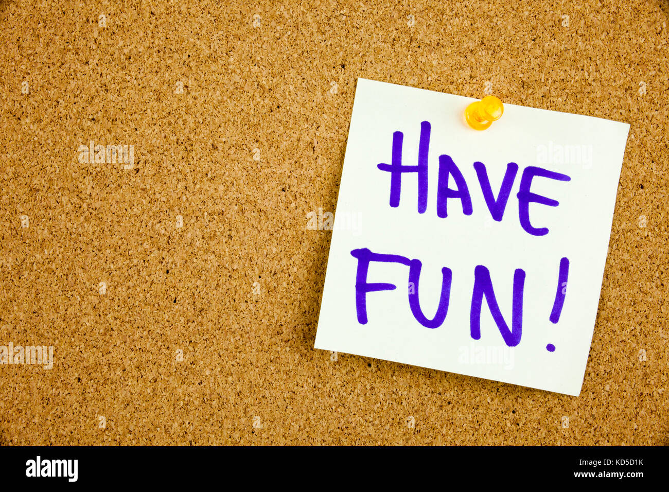 A yellow sticky note writing, caption, inscription Have fun in black ...