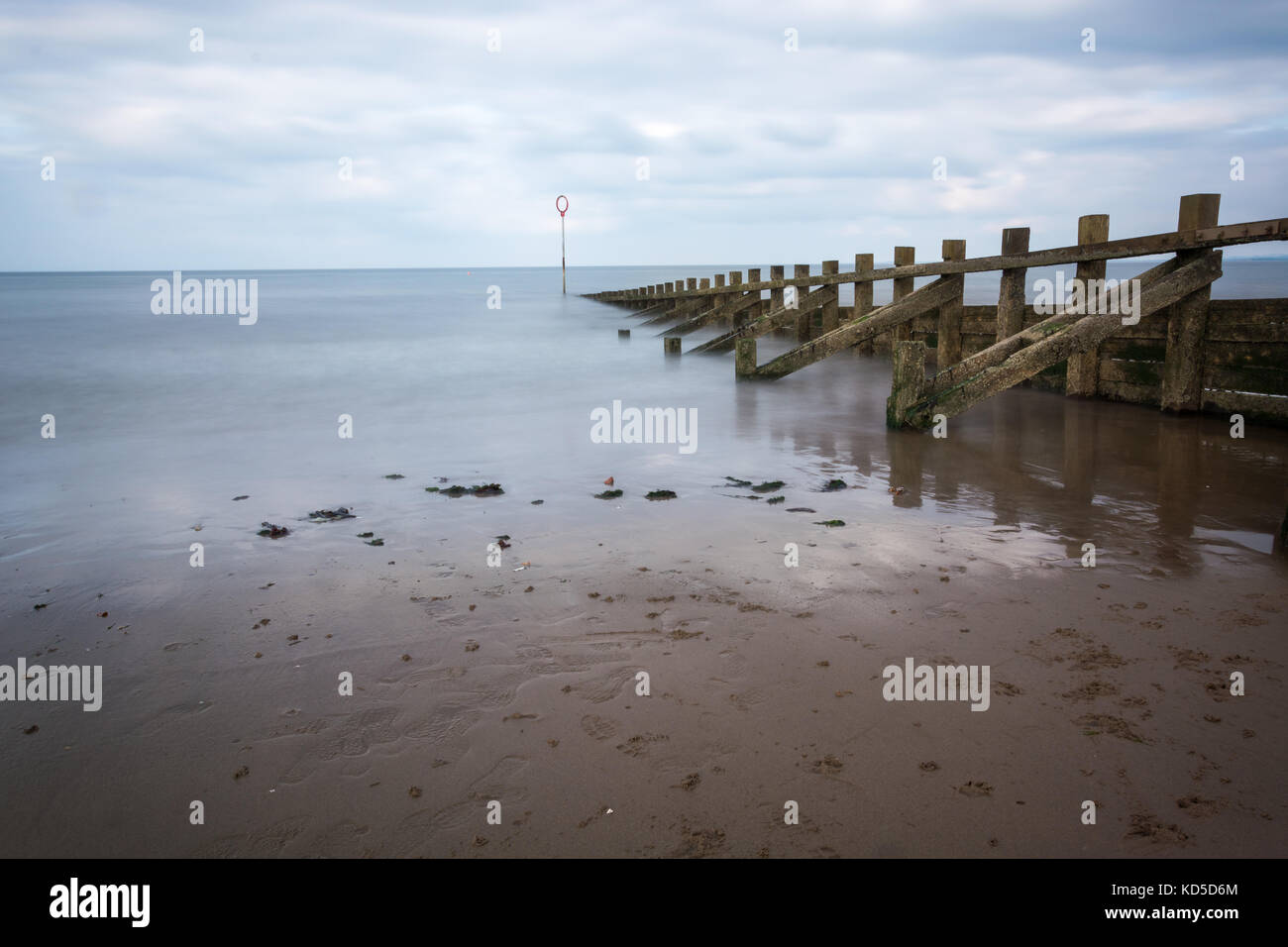 Portobello beach with groynes and a calm sea with clouds above Stock ...