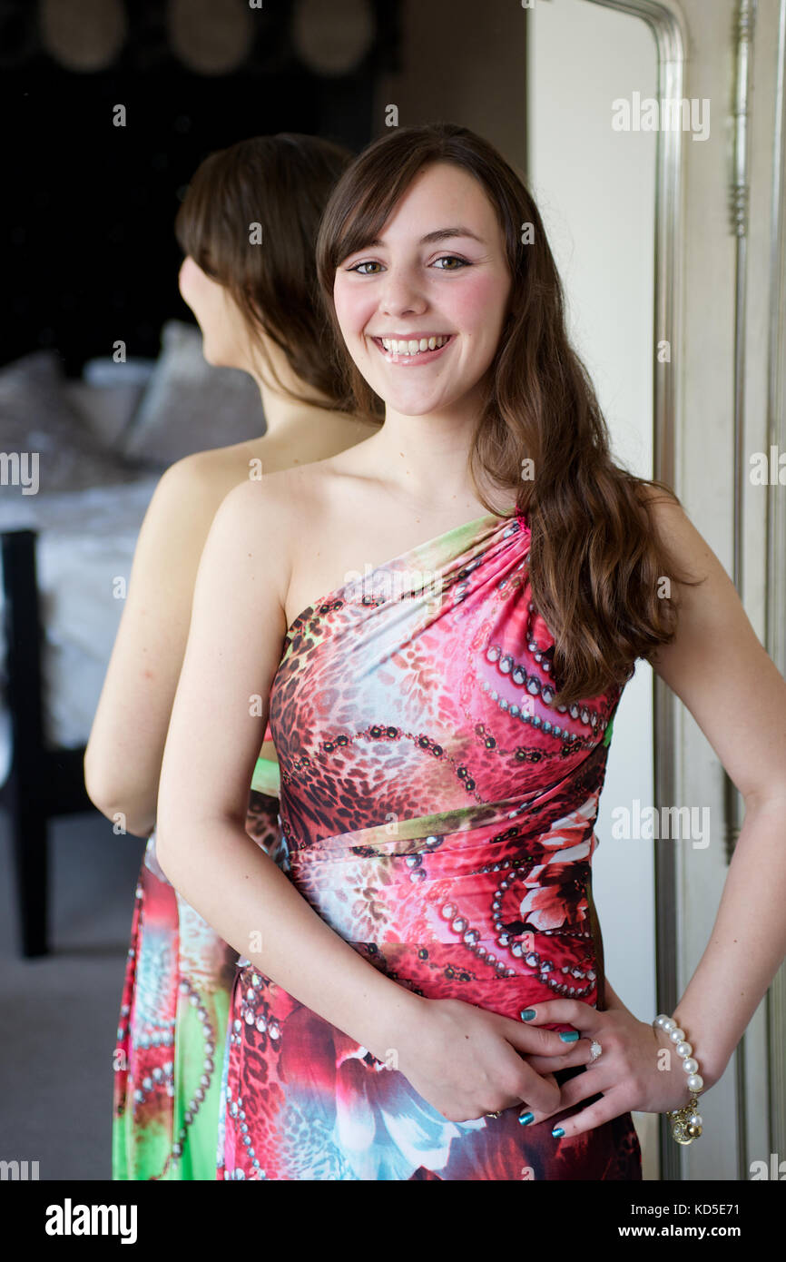 Beautiful brunette girl wearing a dress in a boudoir location Stock ...