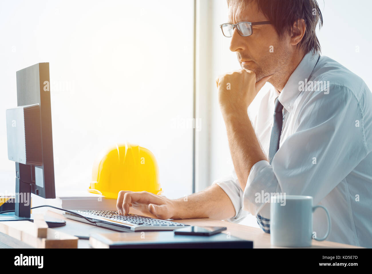 Architect working in office, construction engineer working with ...