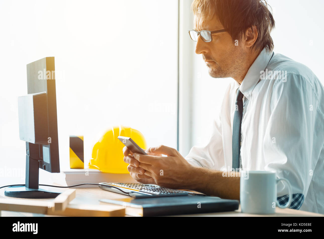 Architect working in office, construction engineer working with ...