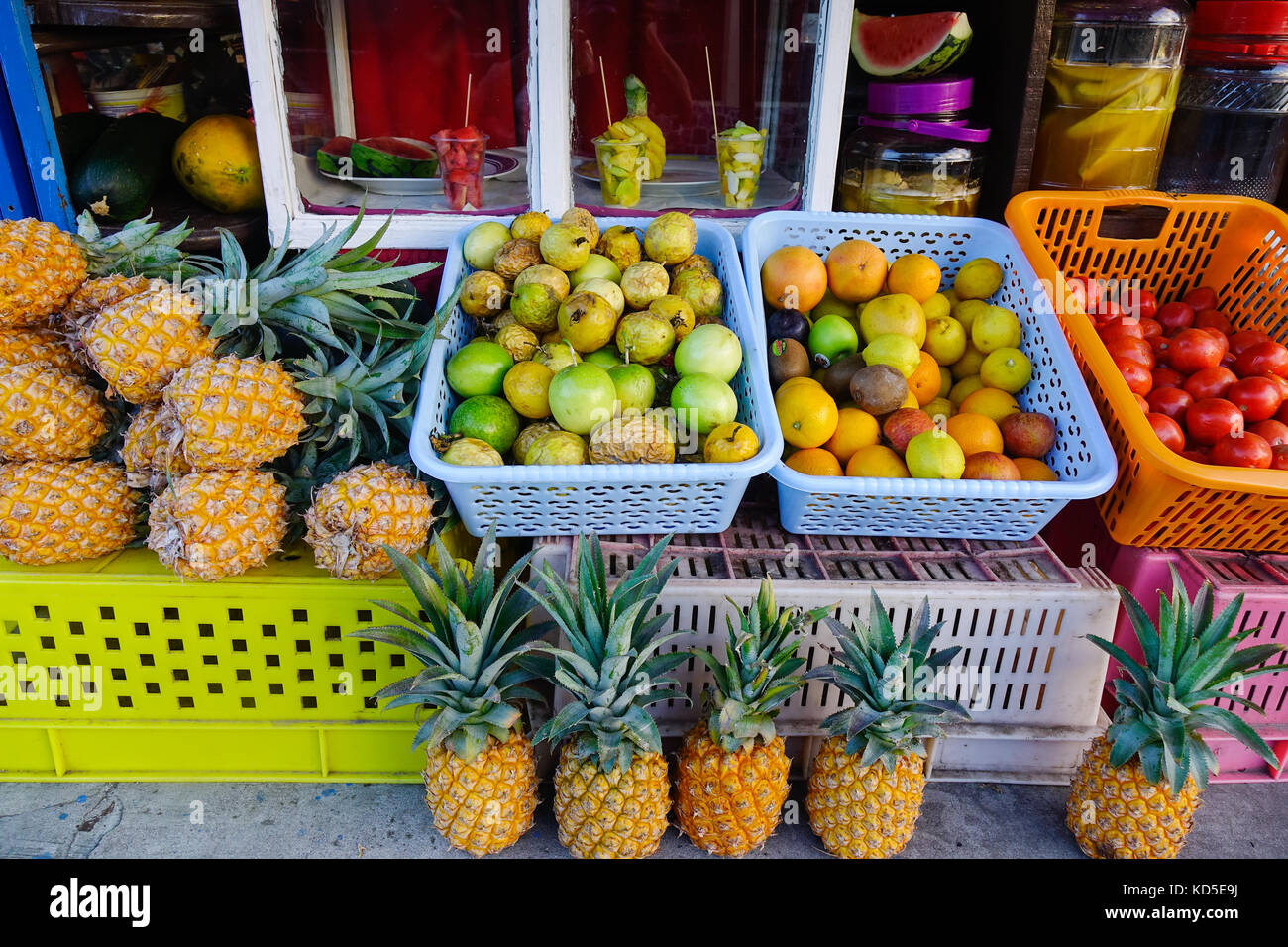 Selling fruits at a local market in Mahebourg Mauritius. Mahebourg is a ...