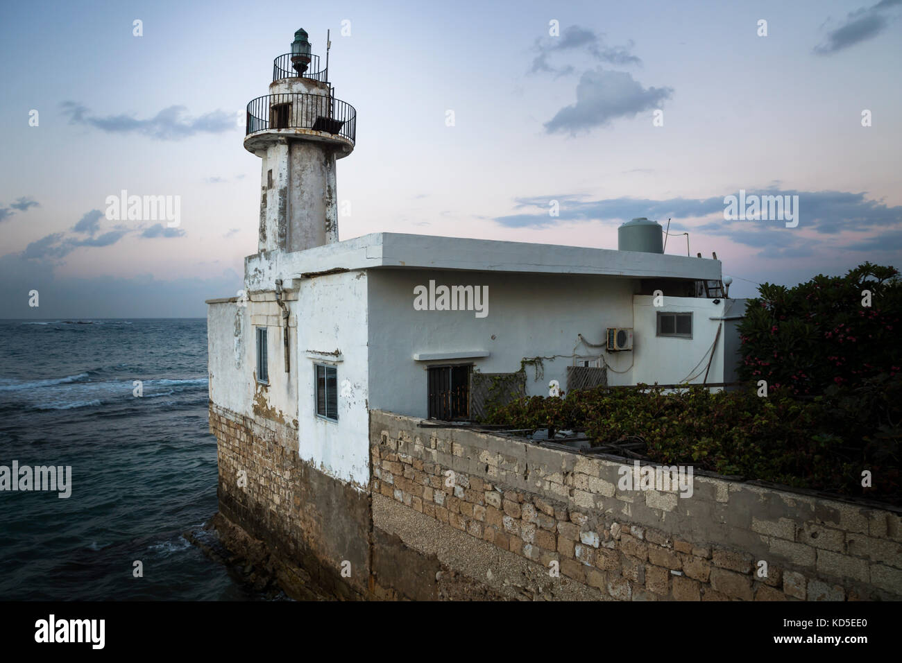 Sunset at old lighthouse in Tyre, Sour, Lebanon Stock Photo - Alamy