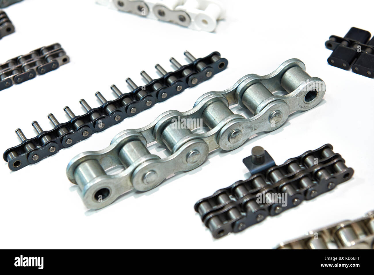 Chain links for different vehicle mechanisms on white Stock Photo - Alamy