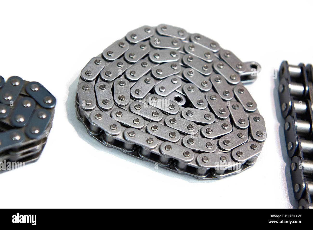 Chain links for different vehicle mechanisms on white Stock Photo - Alamy