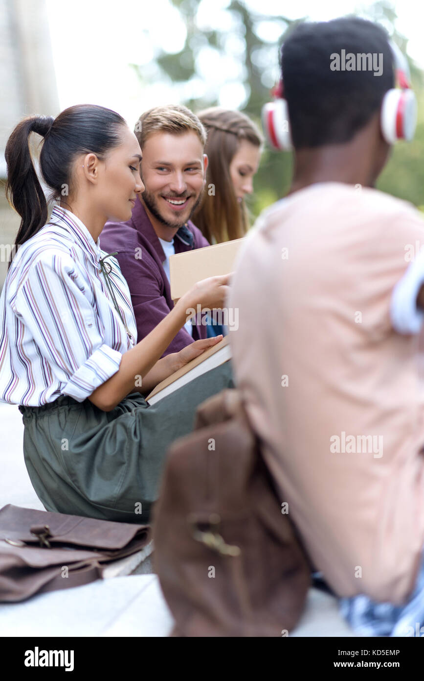 multiethnic students reading books Stock Photo - Alamy