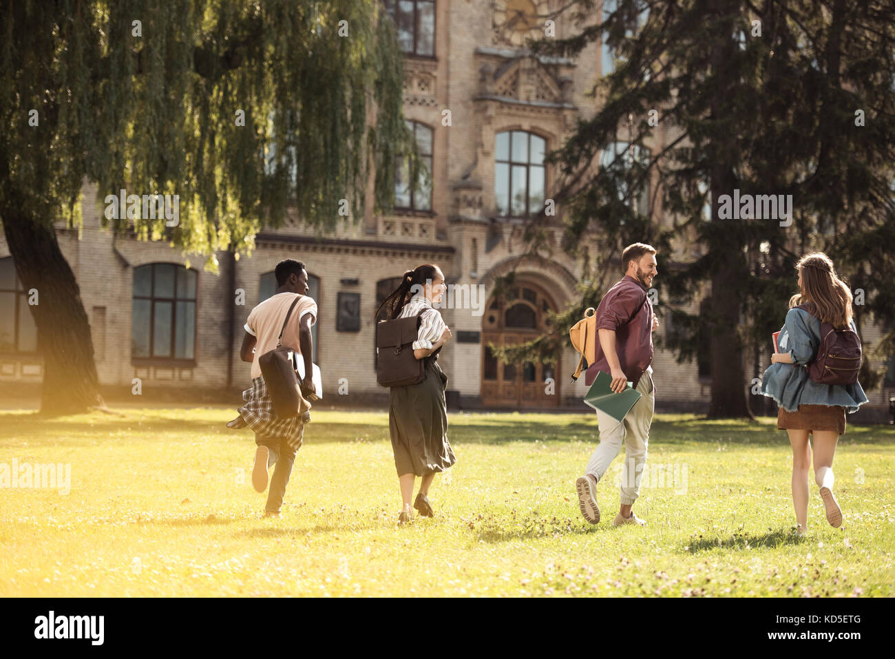students running to university Stock Photo - Alamy