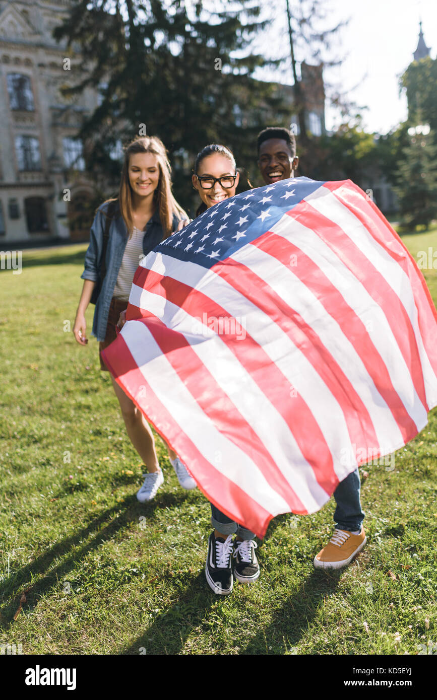 multicultural friends with american flag Stock Photo - Alamy