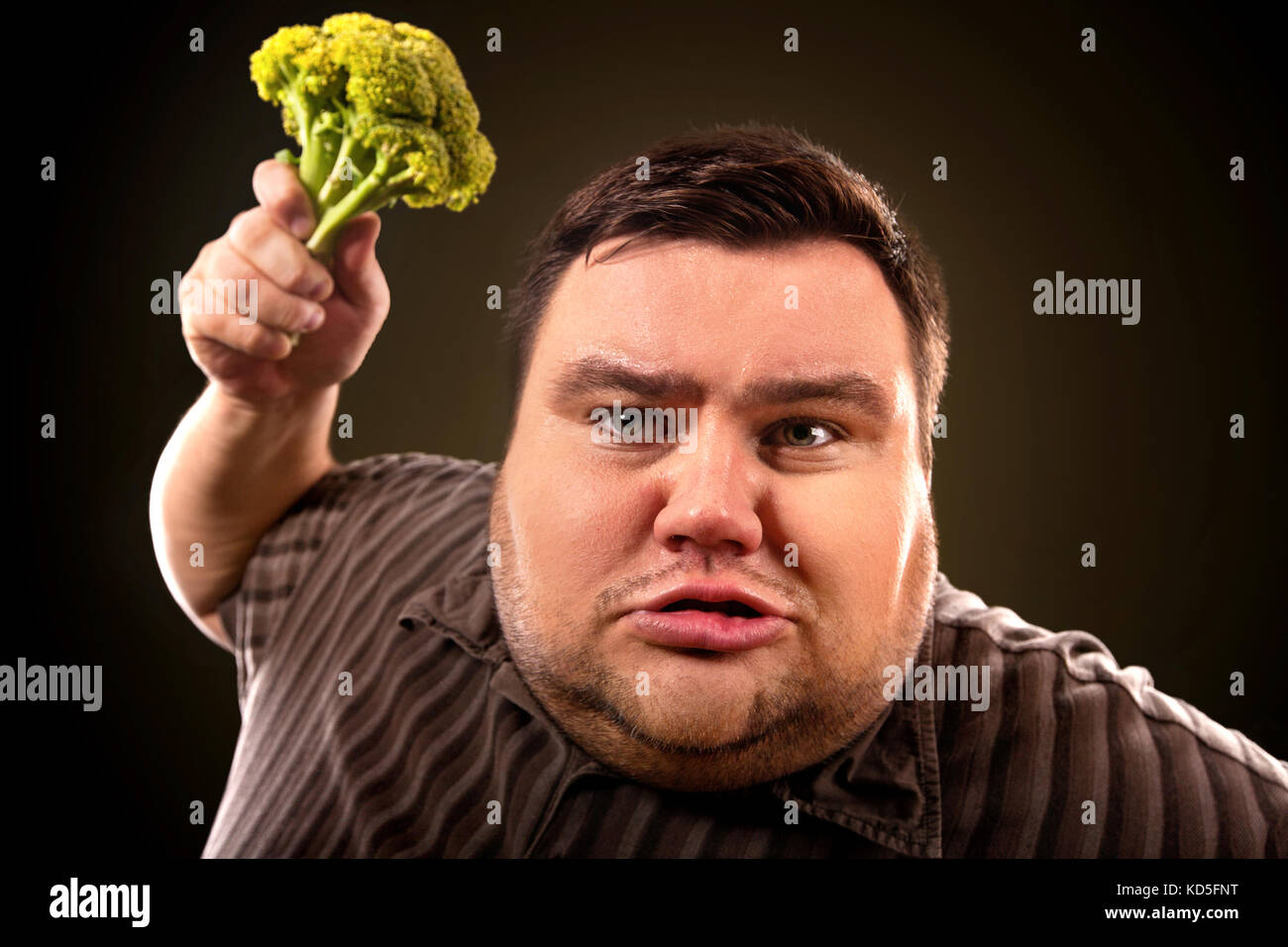 Diet fat man eating healthy food . Healthy breakfast with vegetables ...