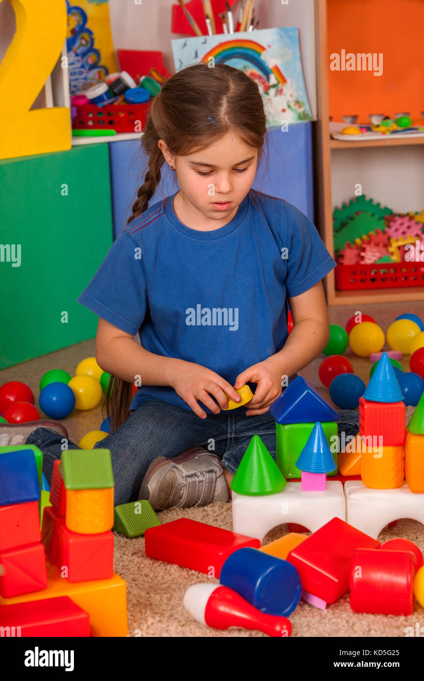 Children building blocks in kindergarten. Group kids playing toy floor ...