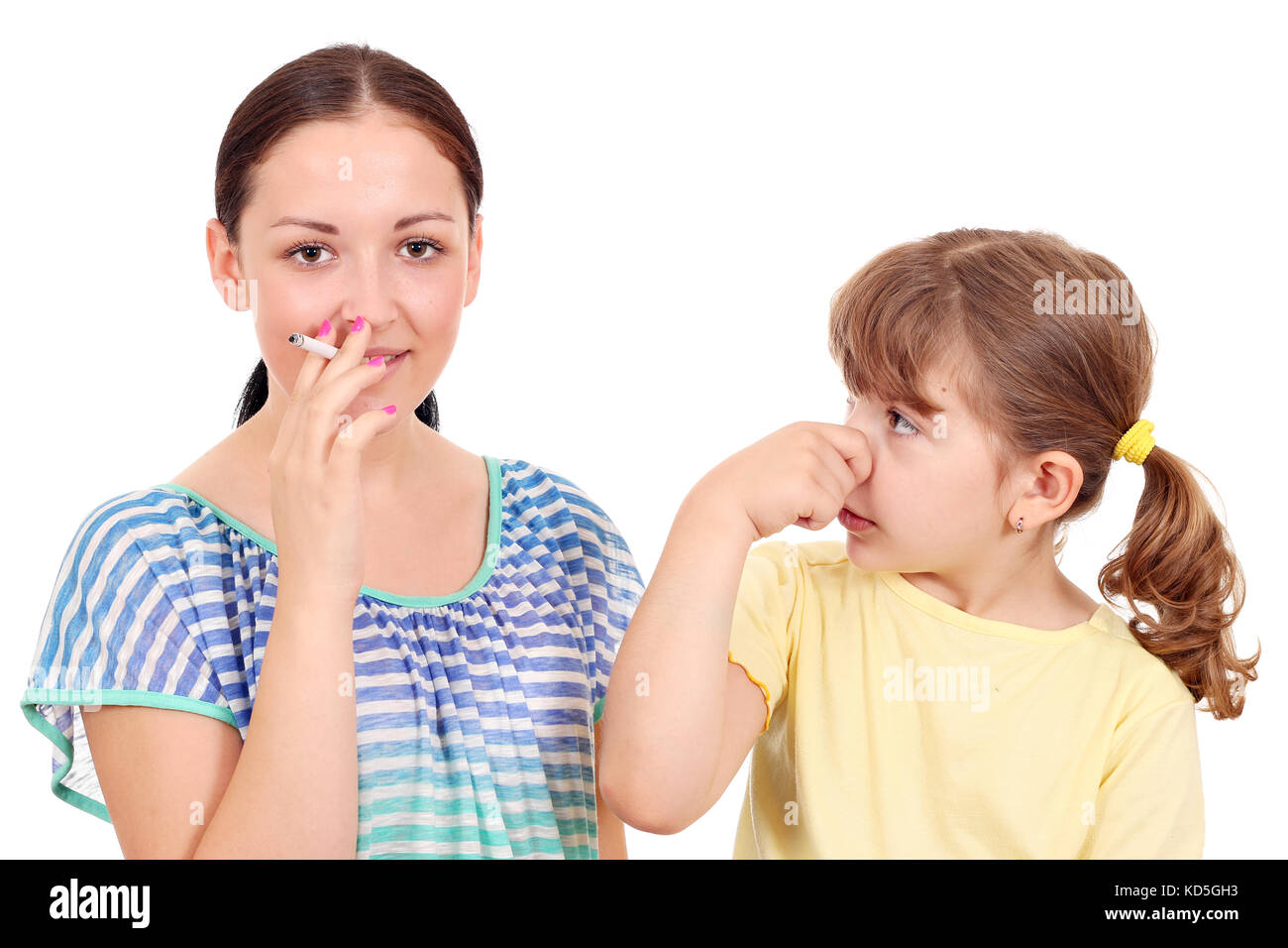 little girl bothered by tobacco smoke Stock Photo - Alamy