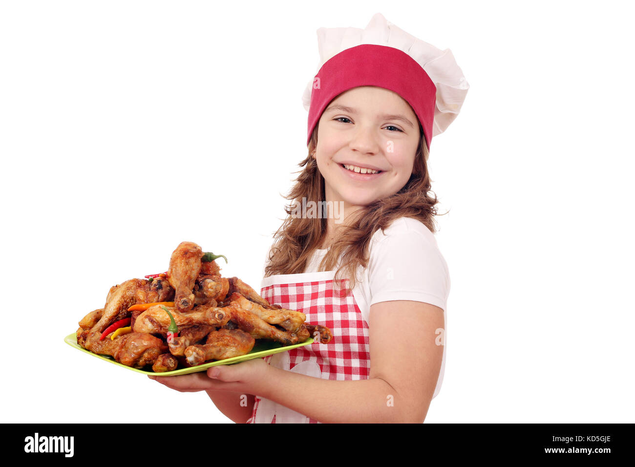 happy little girl cook with chicken drumstick on plate Stock Photo - Alamy