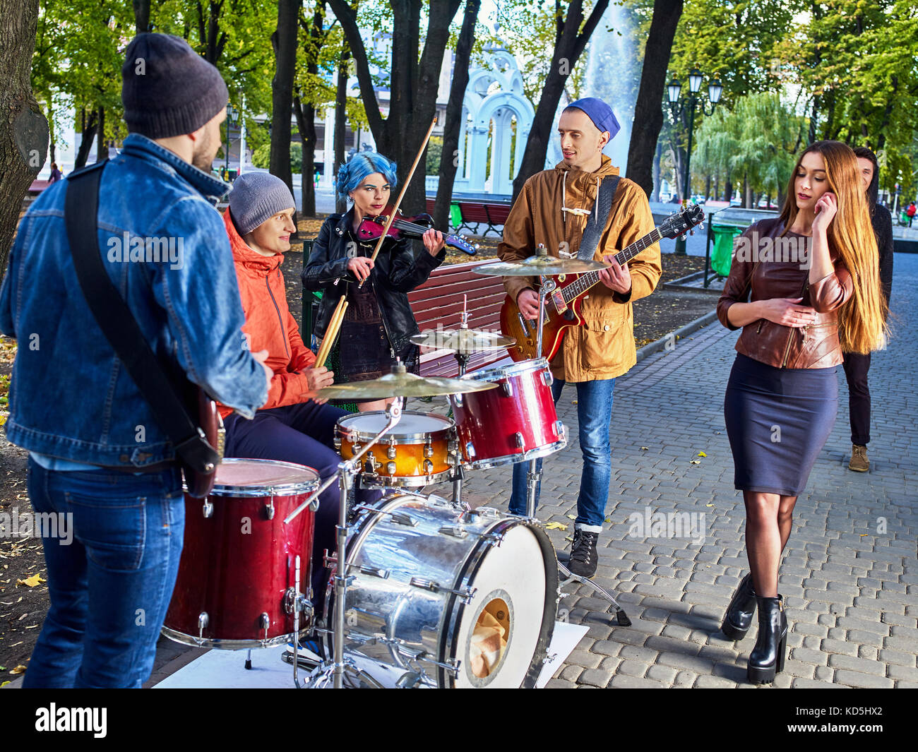 Festival music band. Friends playing on percussion instruments city ...