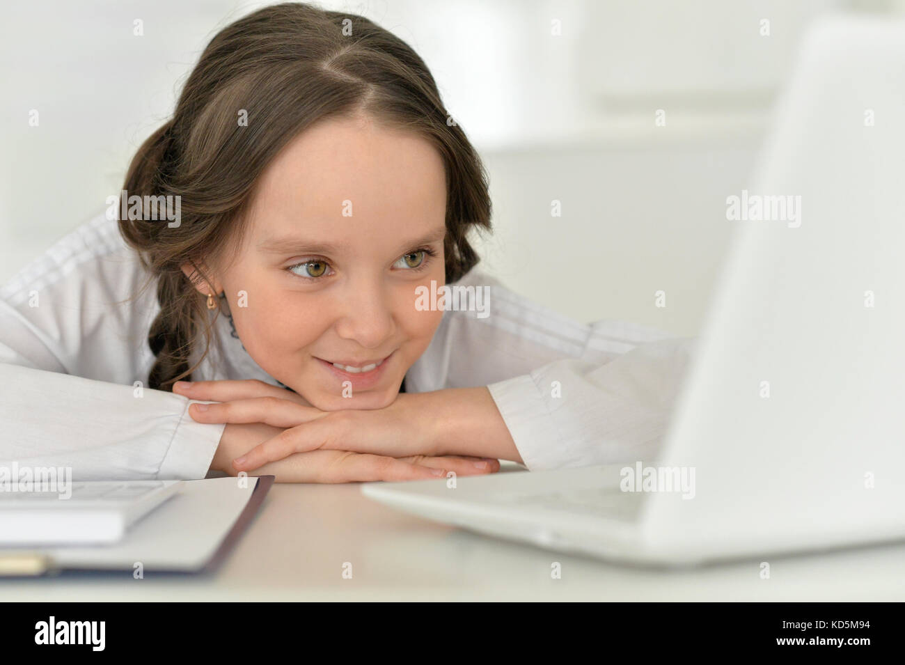Cute girl with laptop Stock Photo - Alamy