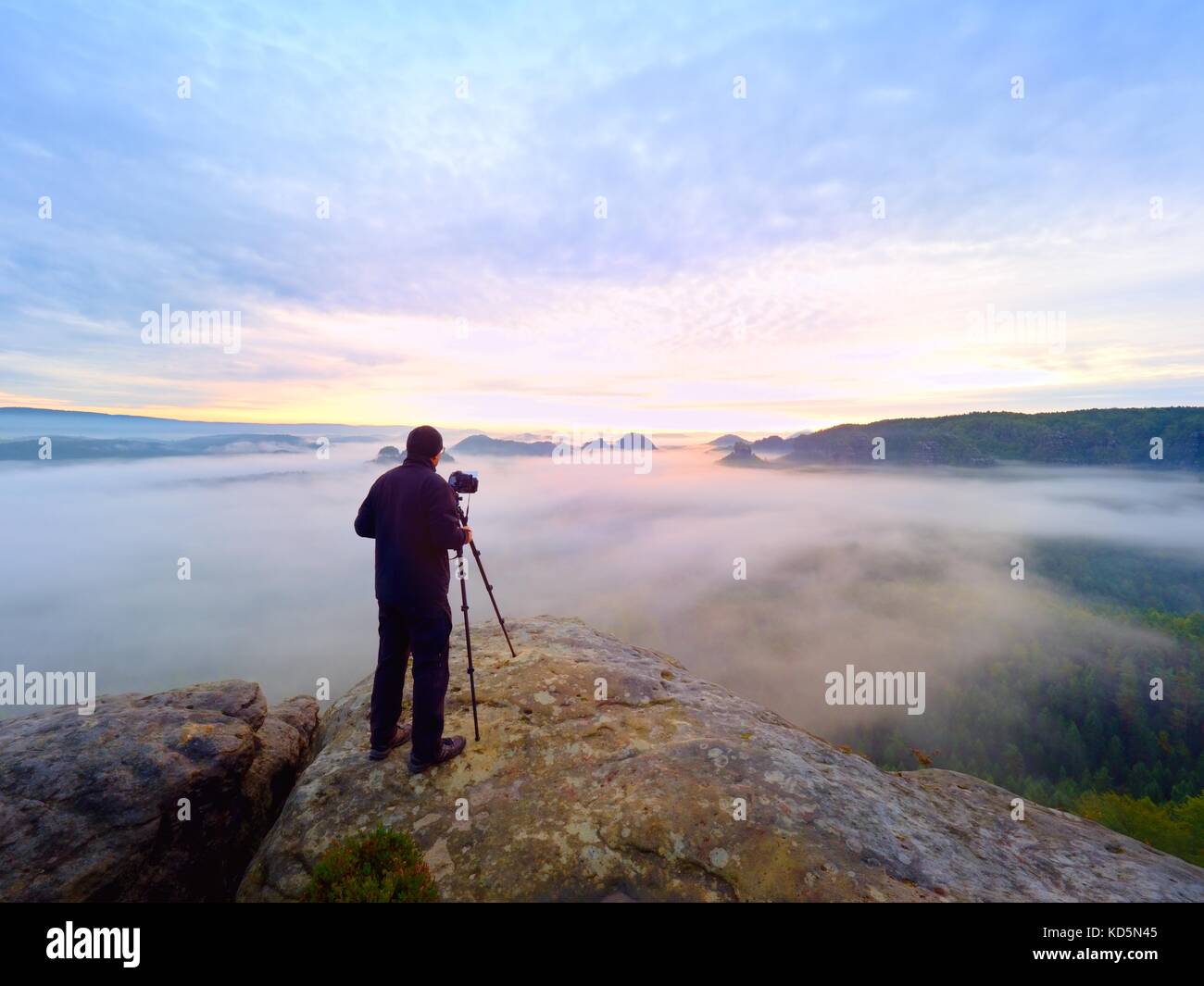 Photographer framing picture with eye on viewfinder. Photo enthusiast ...