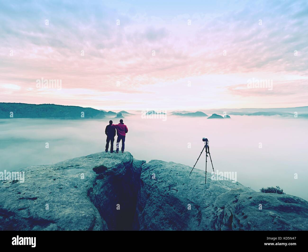 Two men enjoy photographying in wild nature. Nature photographer with ...