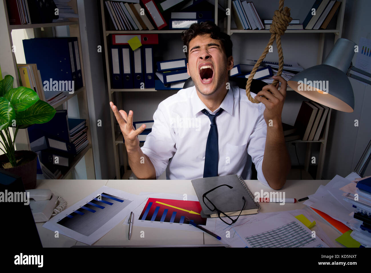 Man businessman working late hours in the office Stock Photo - Alamy