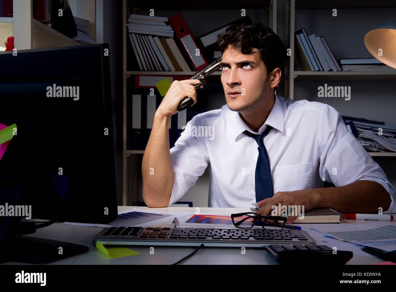 Man businessman working late hours in the office Stock Photo - Alamy