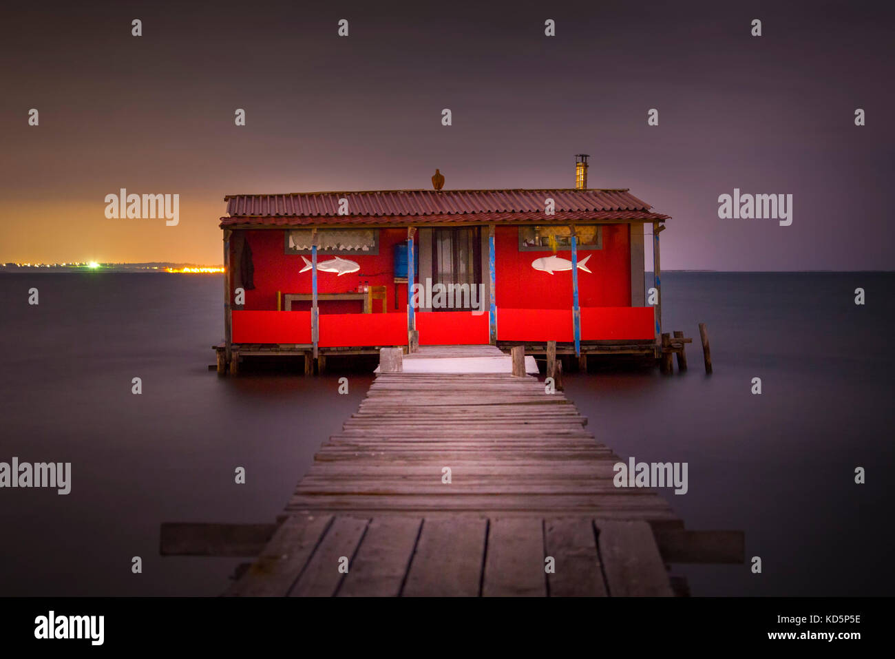 A fisherman's red cabin in axios river delta, Thessaloniki, Greece ...