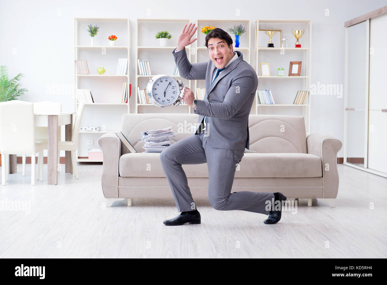Businessman happy meeting his deadlines Stock Photo - Alamy