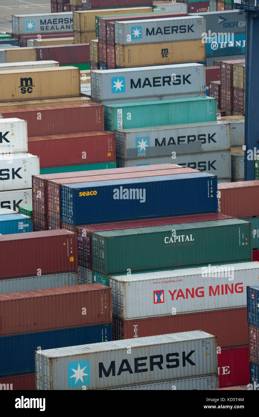 Shipping containers in container port and on-board ship Stock Photo - Alamy