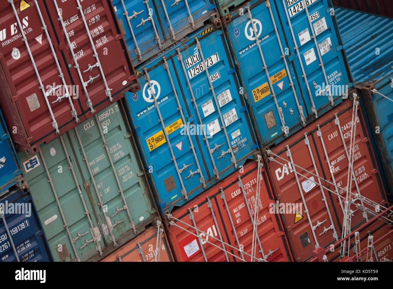 Shipping containers in container port and on-board ship Stock Photo - Alamy