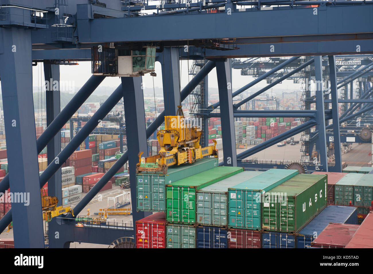 Shipping containers in container port and on-board ship Stock Photo - Alamy