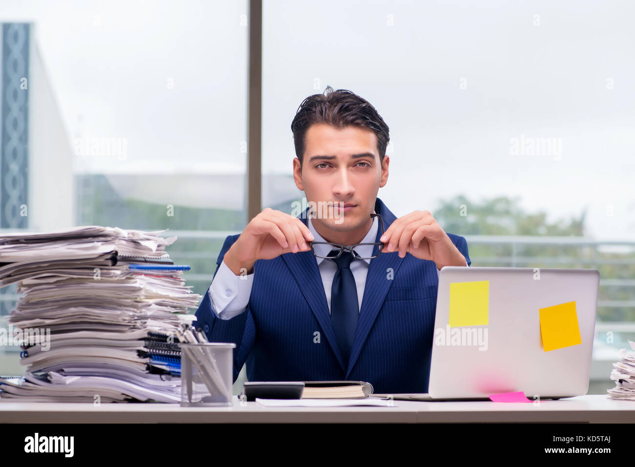Workaholic businessman overworked with too much work in office Stock ...