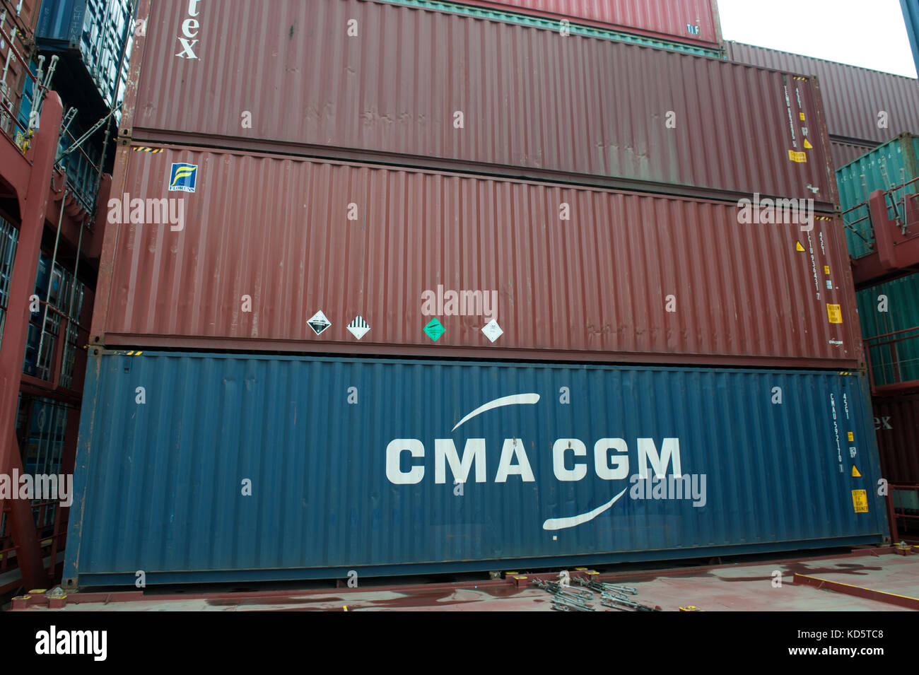 Shipping containers in container port and on-board ship Stock Photo - Alamy