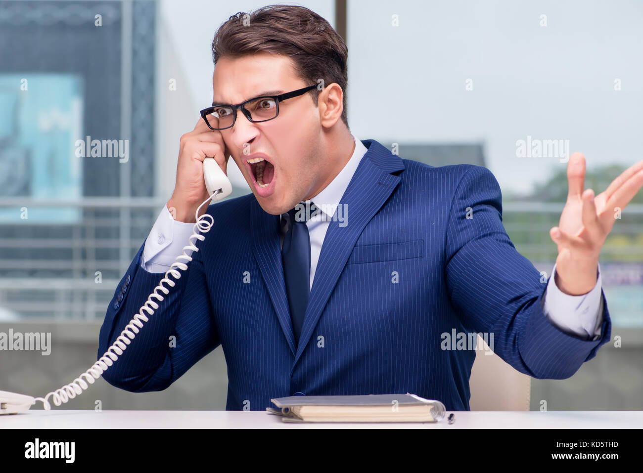 Angry call center employee yelling at customer Stock Photo - Alamy