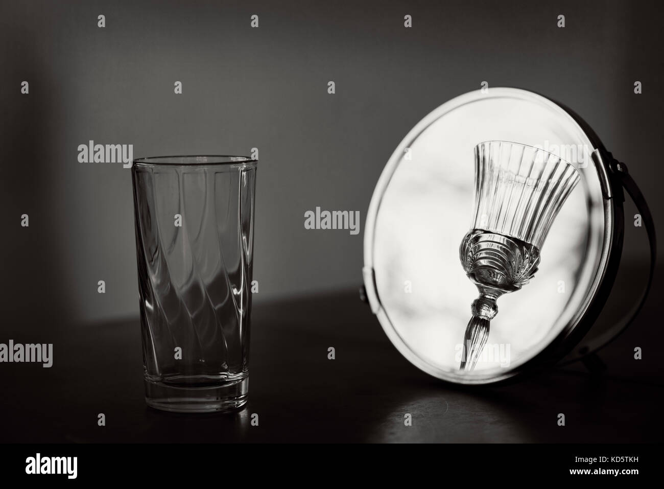 Ordinary glass is looking in a mirror. The reflection is on a beautiful ...