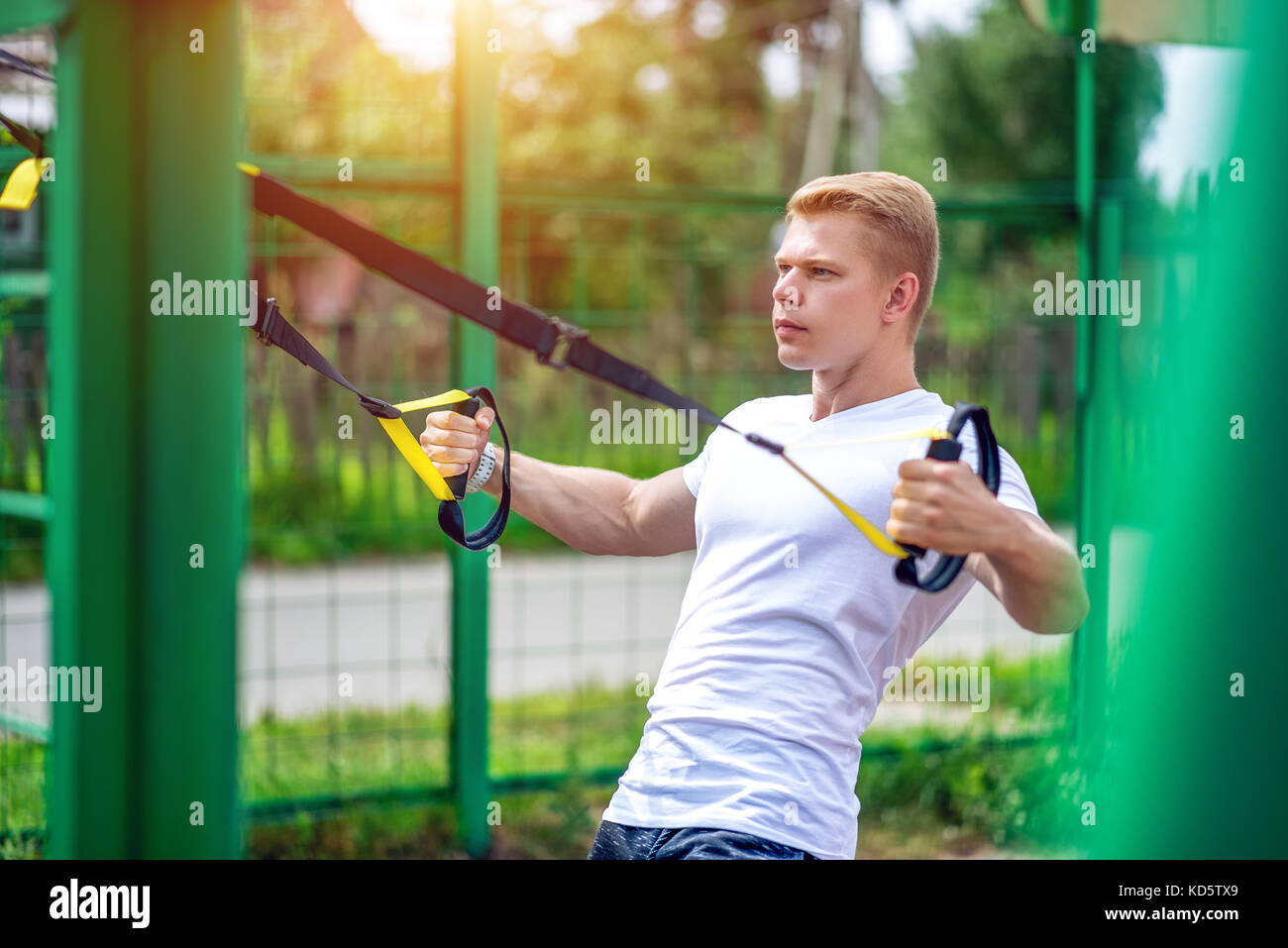 Athlete straps muscles of arm muscles biceps triceps. A man is an ...