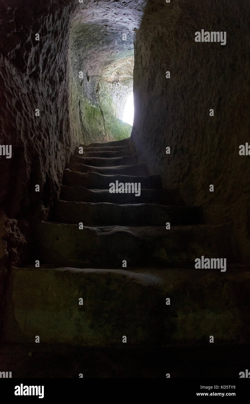 View of hidden passage excavated in the rock Stock Photo - Alamy