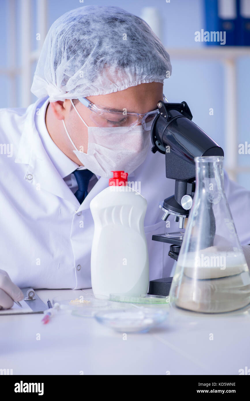 Man in the lab testing new cleaning solution detergent Stock Photo - Alamy