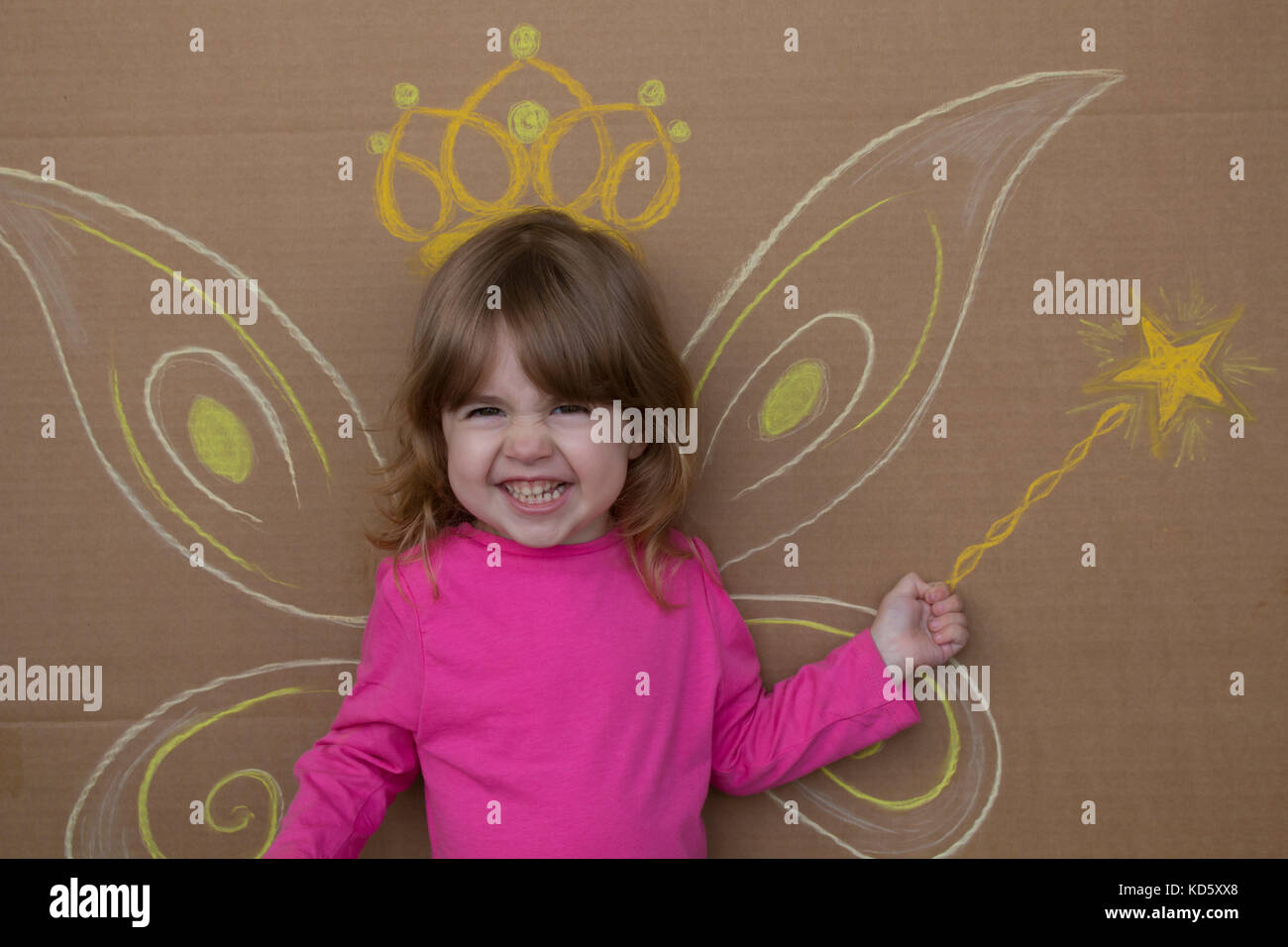 Girl in the image of fairies with painted wings and magic wand sitting ...