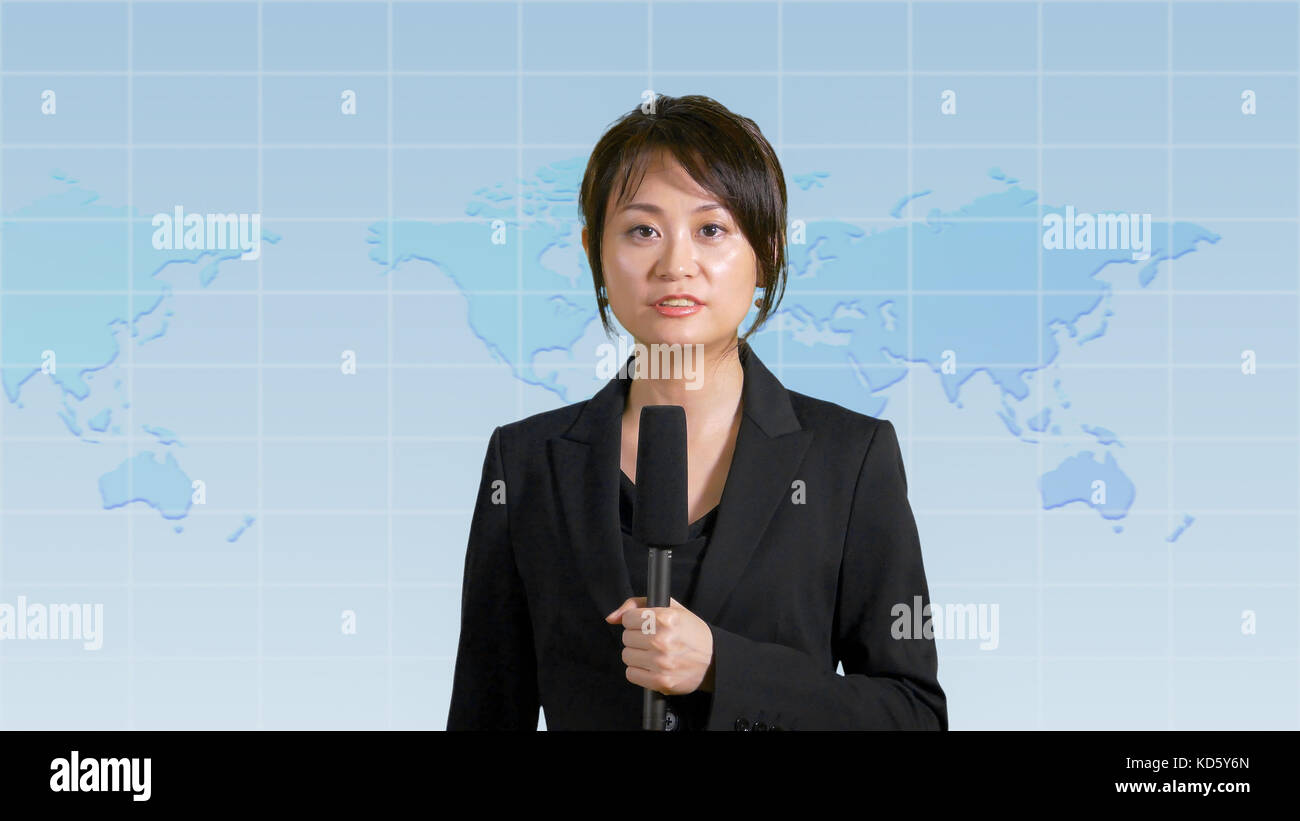 Asian American female news anchor in studio with map background, TV ...