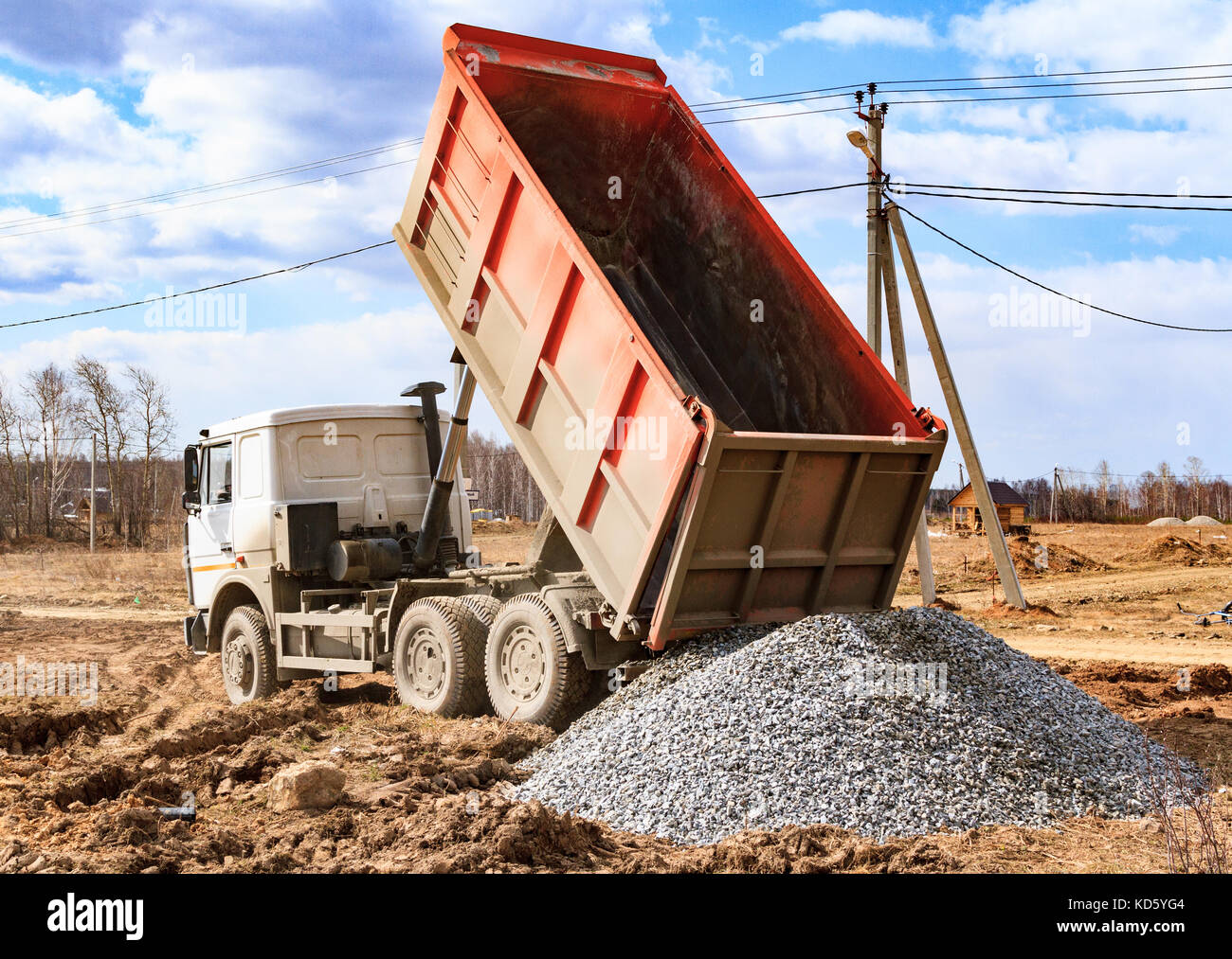 Dumptruck in action on a construction site Stock Photo - Alamy