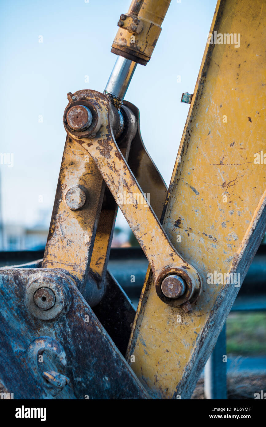 Working excavator in a construction site - machine moving soil Stock ...