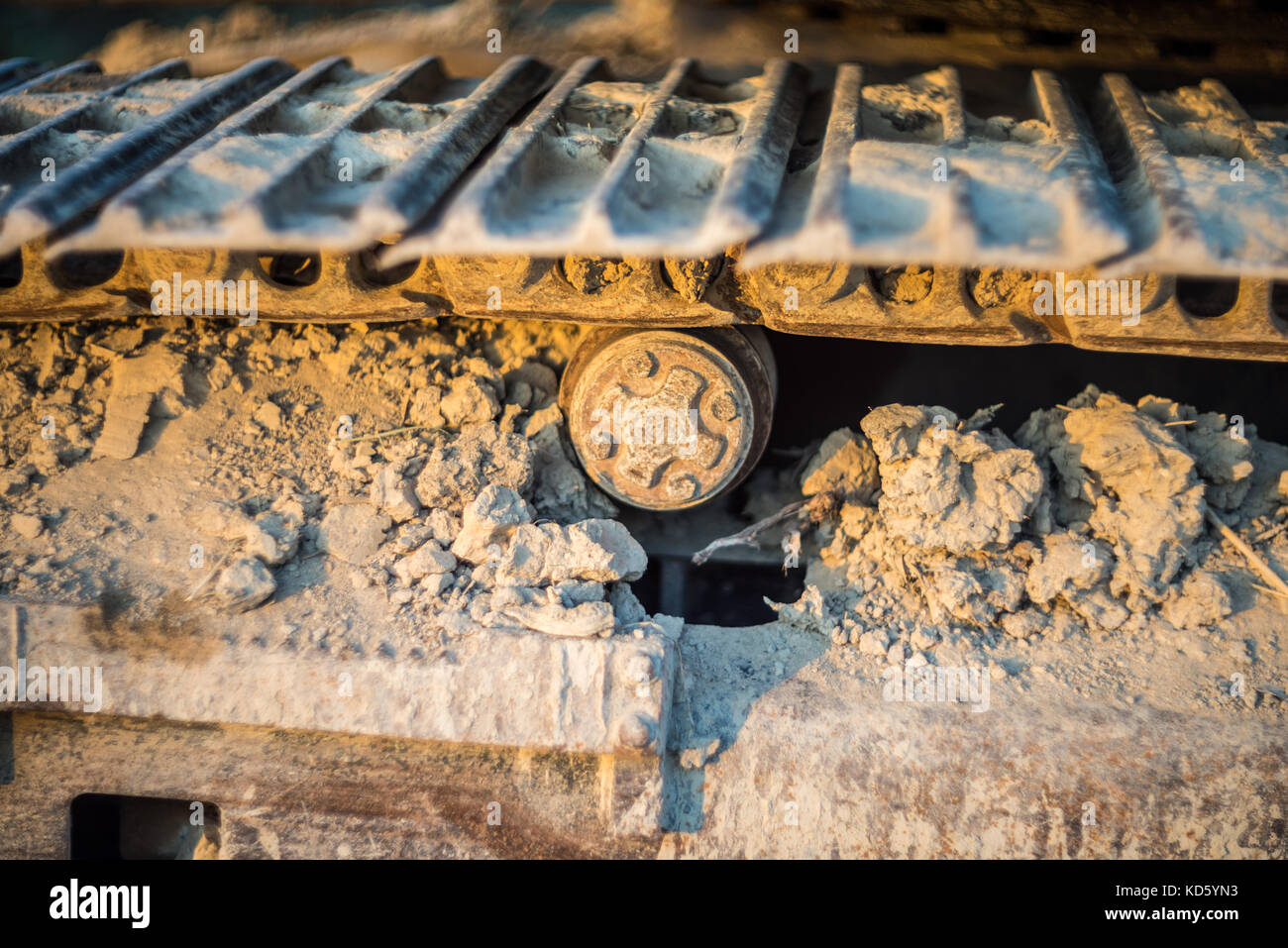 Working excavator in a construction site - machine moving soil Stock ...