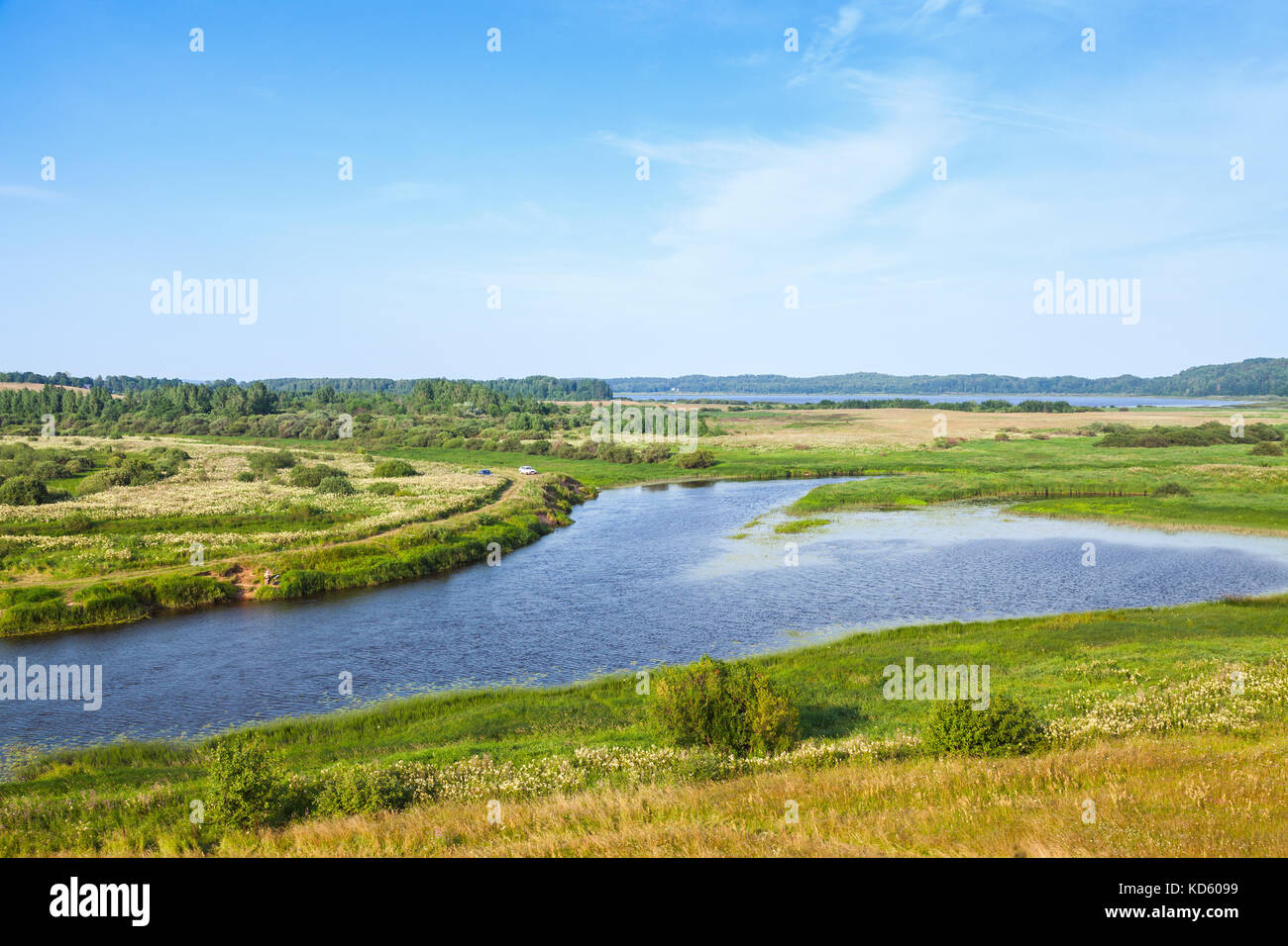 Empty rural Russian landscape. Sorot river under blue cloudy sky in the ...