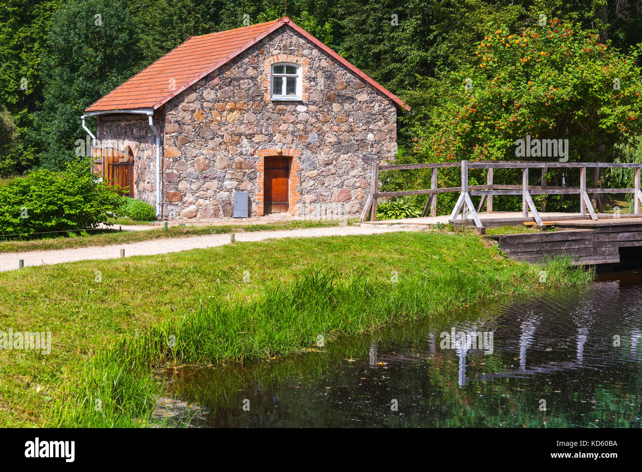 Rural Russian summer landscape with old stone flax storage ...